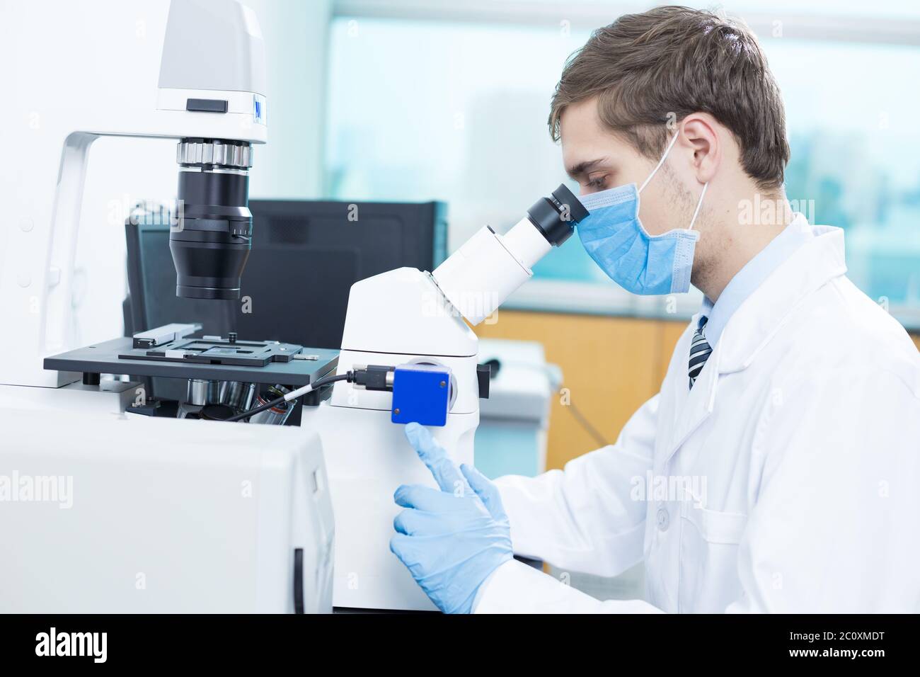 young man does medical experiment in lab Stock Photo - Alamy