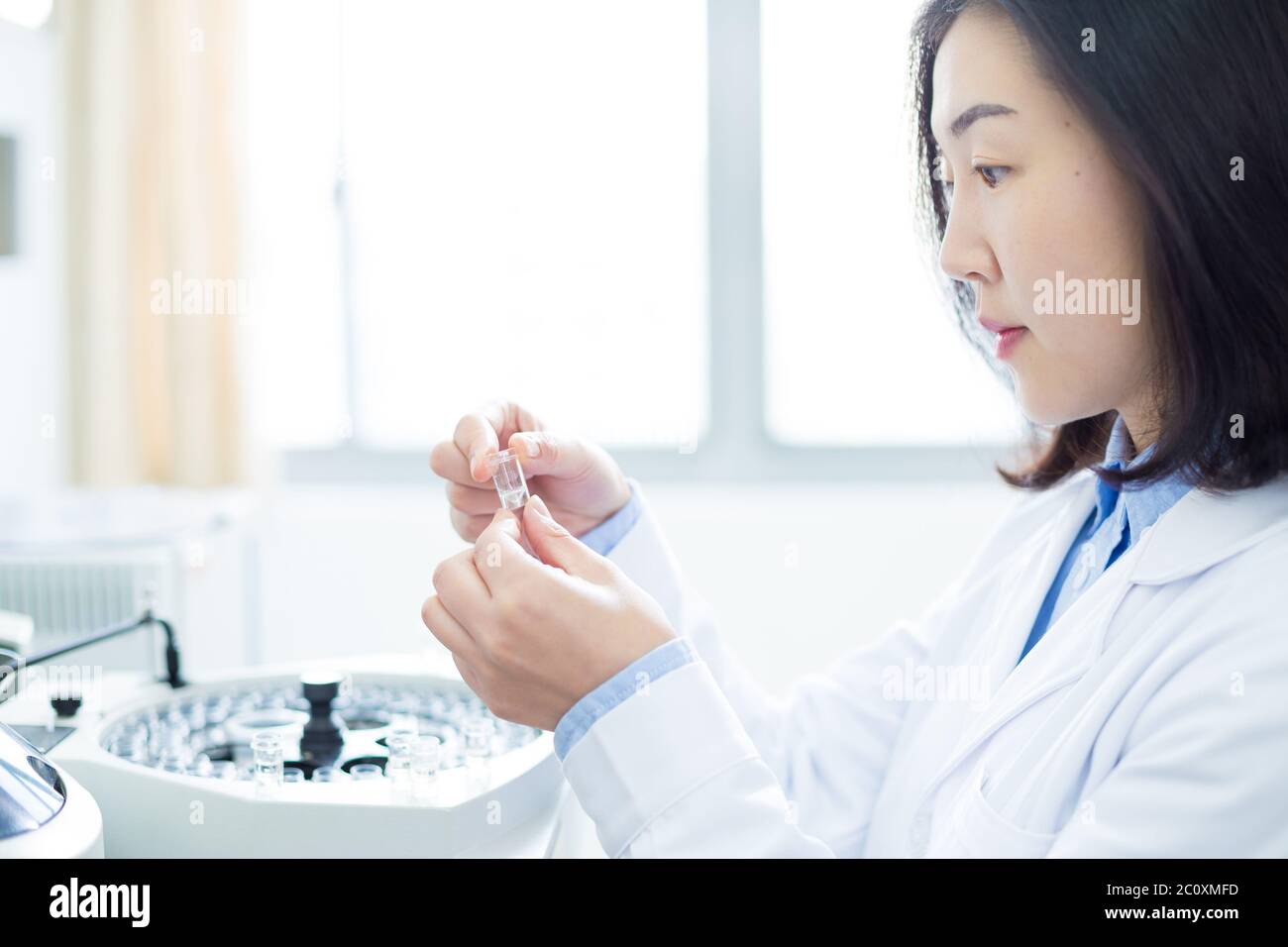 beautiful young girl does medical experiment in lab Stock Photo - Alamy
