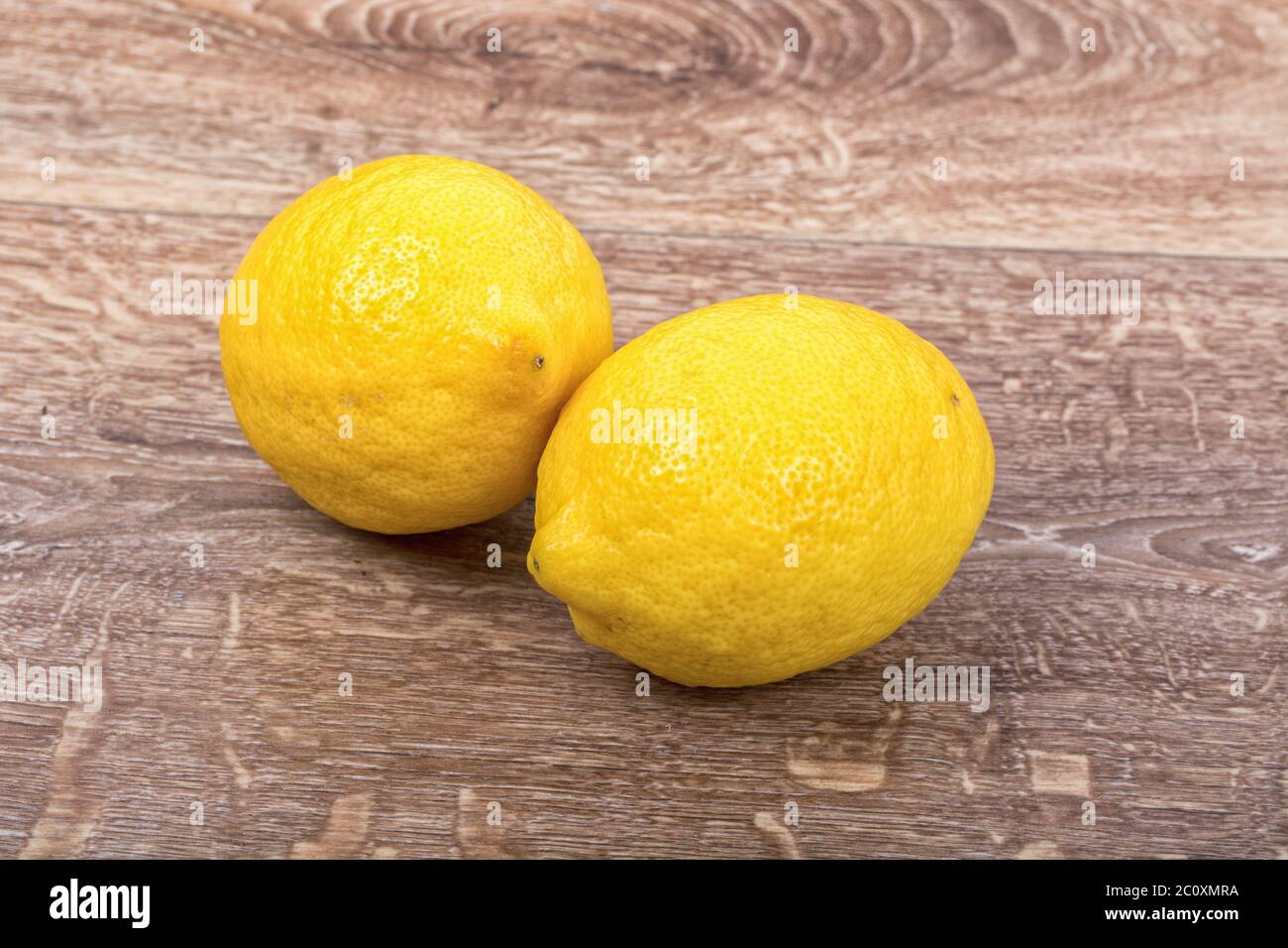 Two lemons on table hi-res stock photography and images - Alamy