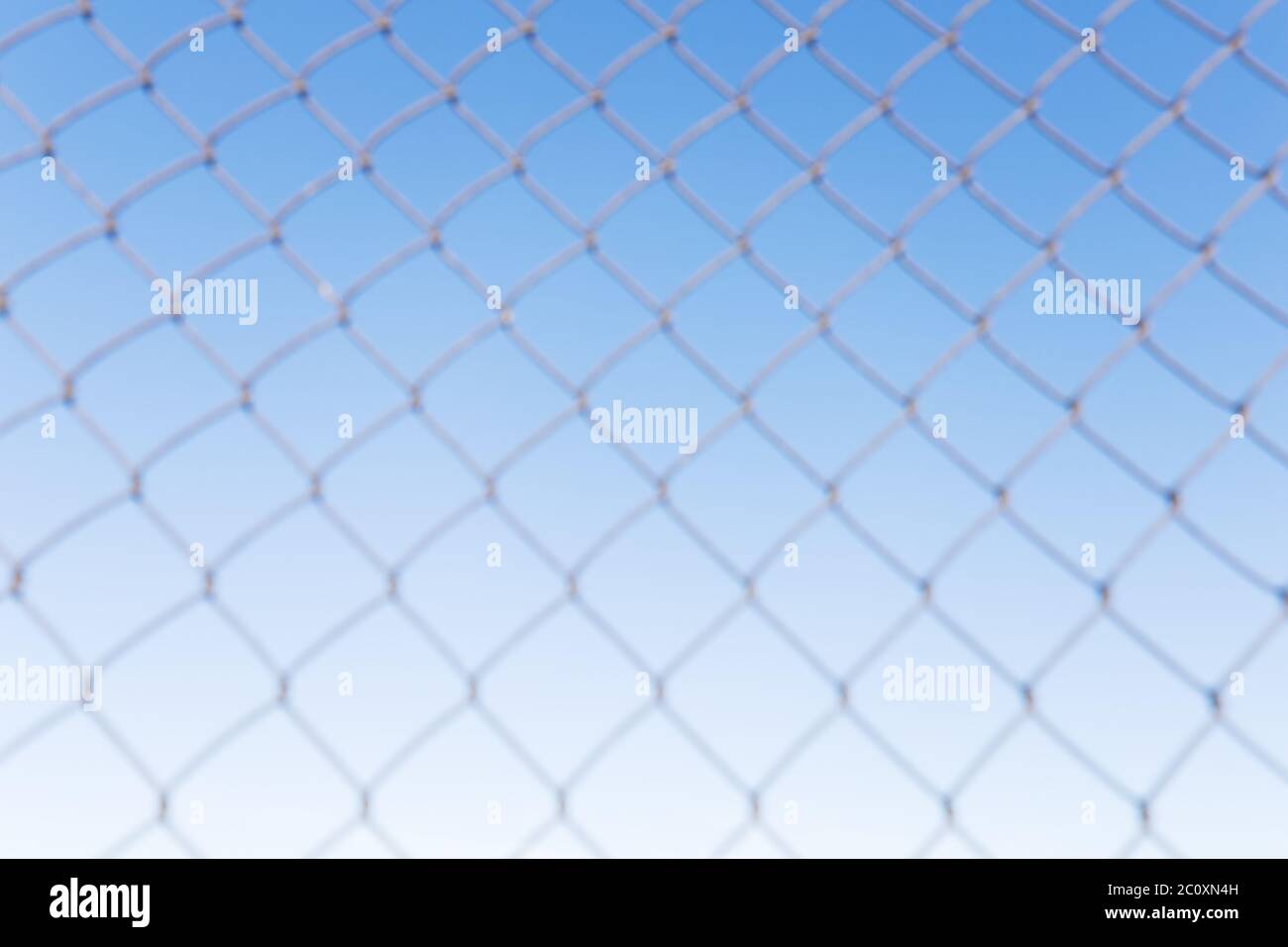 steel net with blue sky background Stock Photo - Alamy