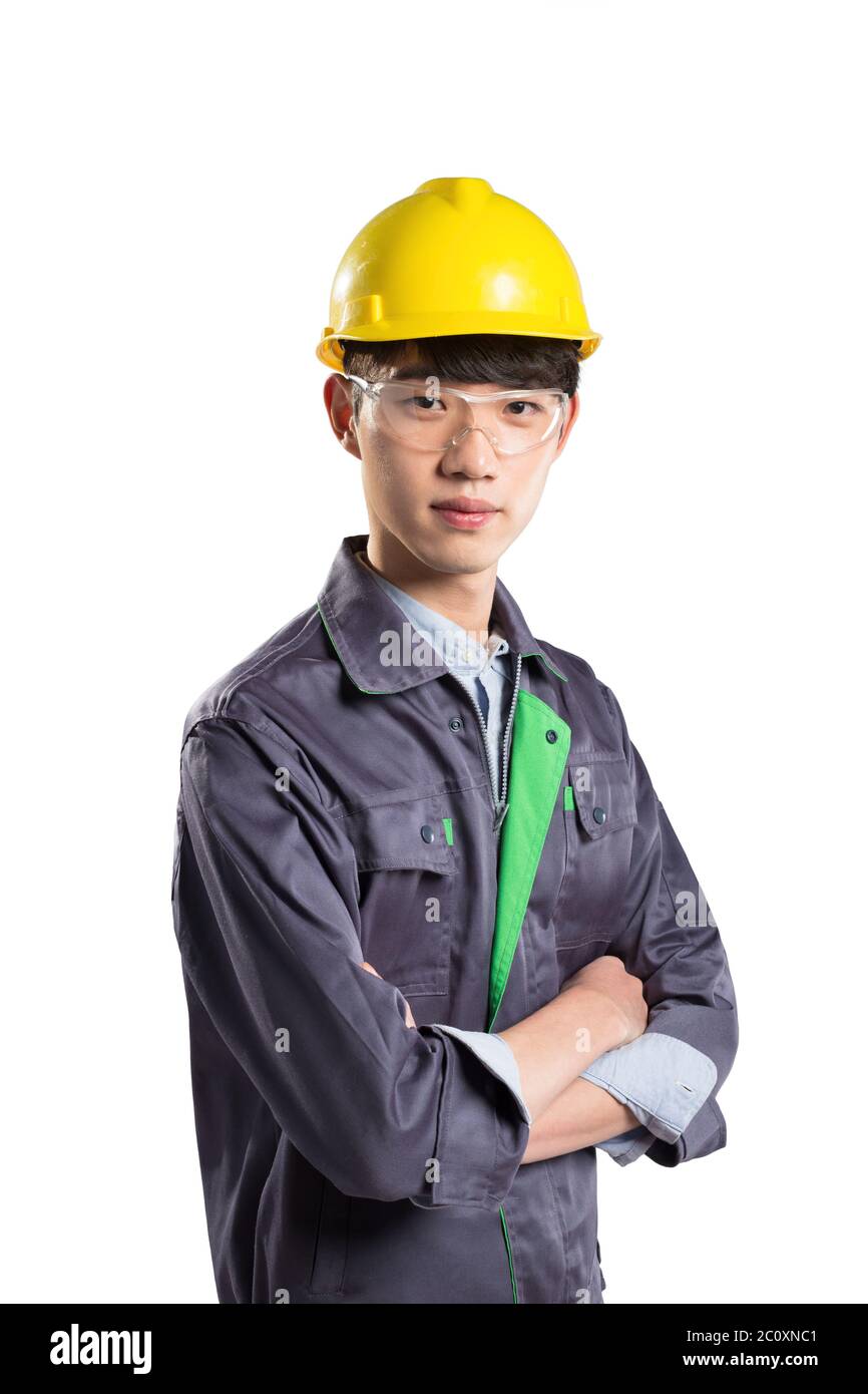 young handsome asian technician on white background Stock Photo - Alamy