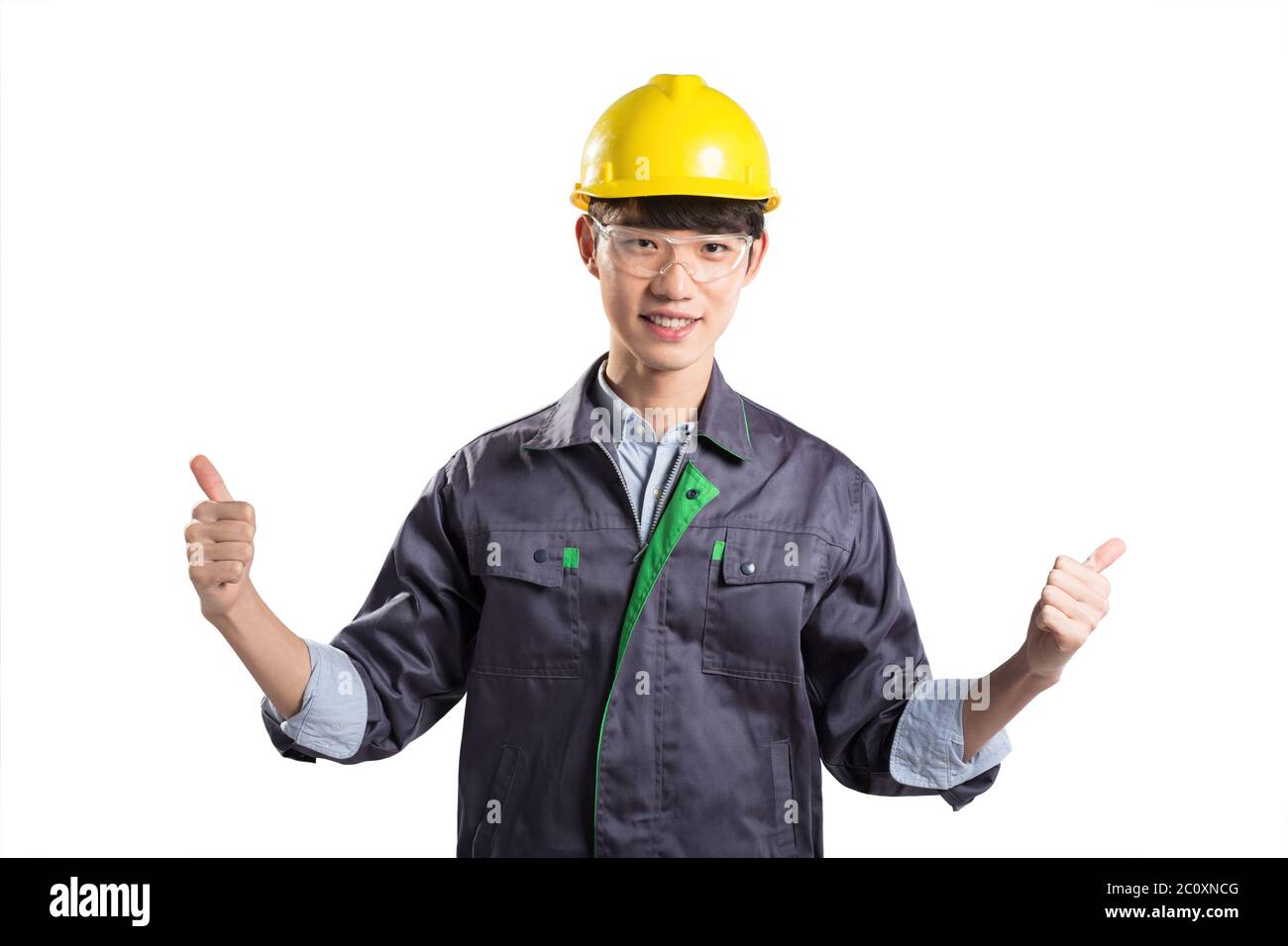 young handsome asian technician on white background Stock Photo - Alamy
