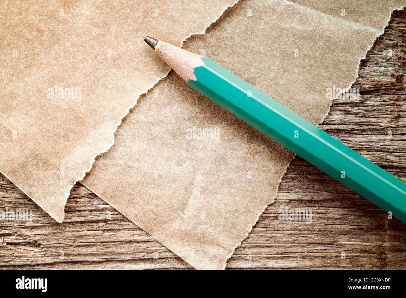 Piece of a old paper and the pencil Stock Photo - Alamy