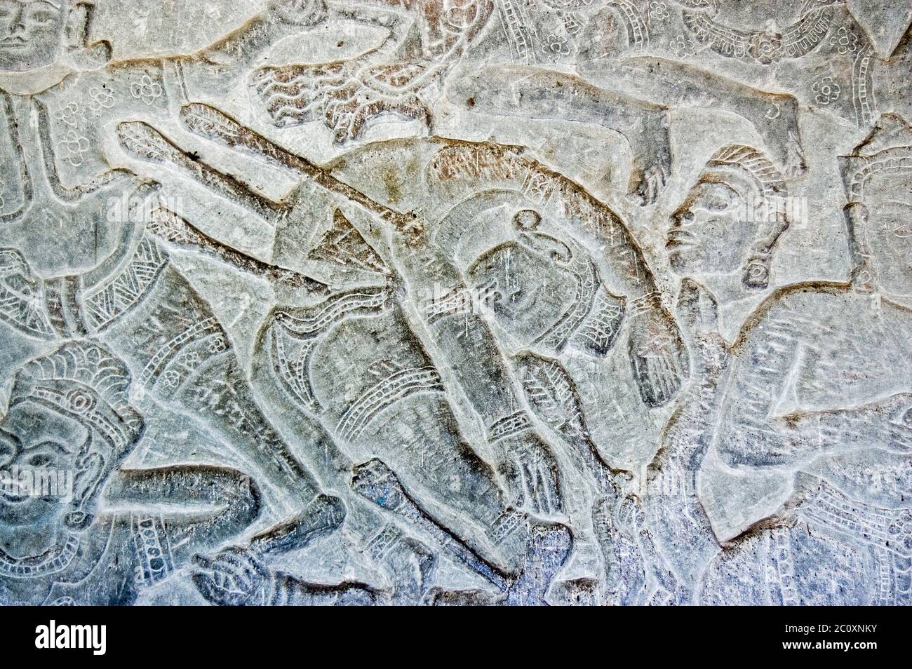 Ancient Khmer bas relief carving showing a soldier killed with three ...