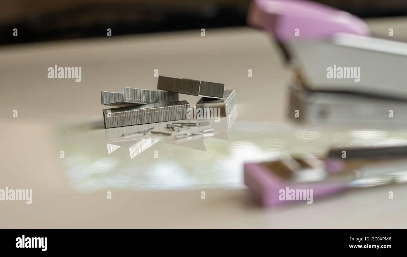 Close up the stapler on the table Stock Photo - Alamy