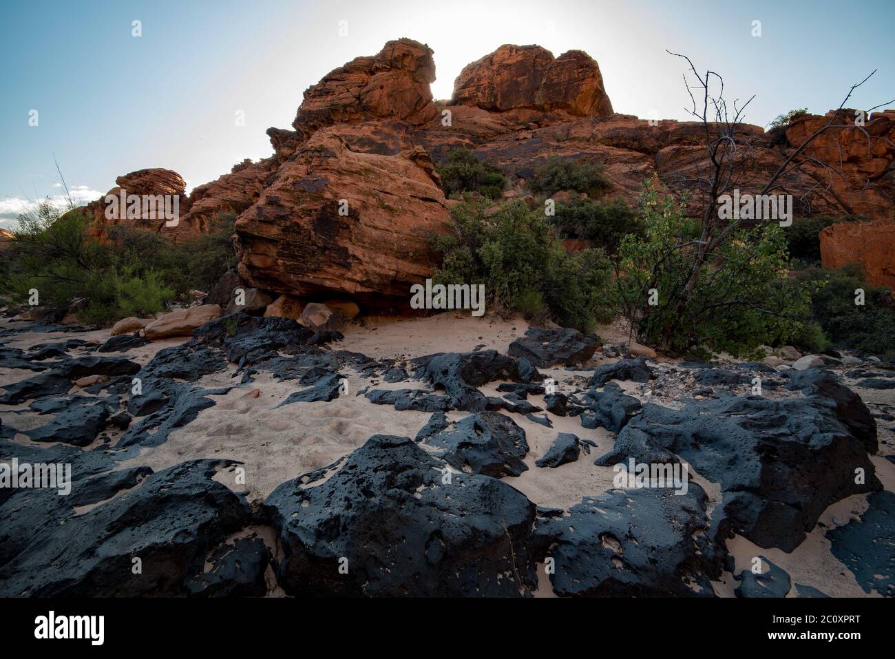 Red rock mountains and volcanic formations dominate this beautiful ...