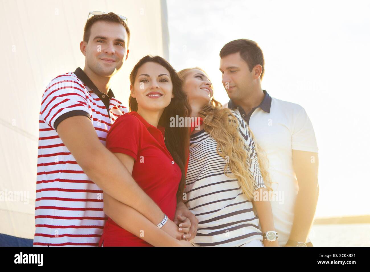 Smiling happy friends on yacht deck Stock Photo - Alamy