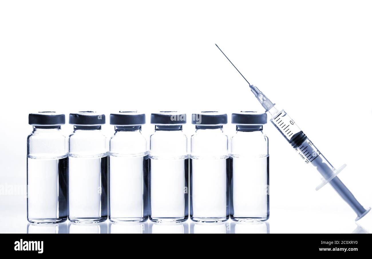 Glass Medicine Vials and Syringe on white background Stock Photo - Alamy