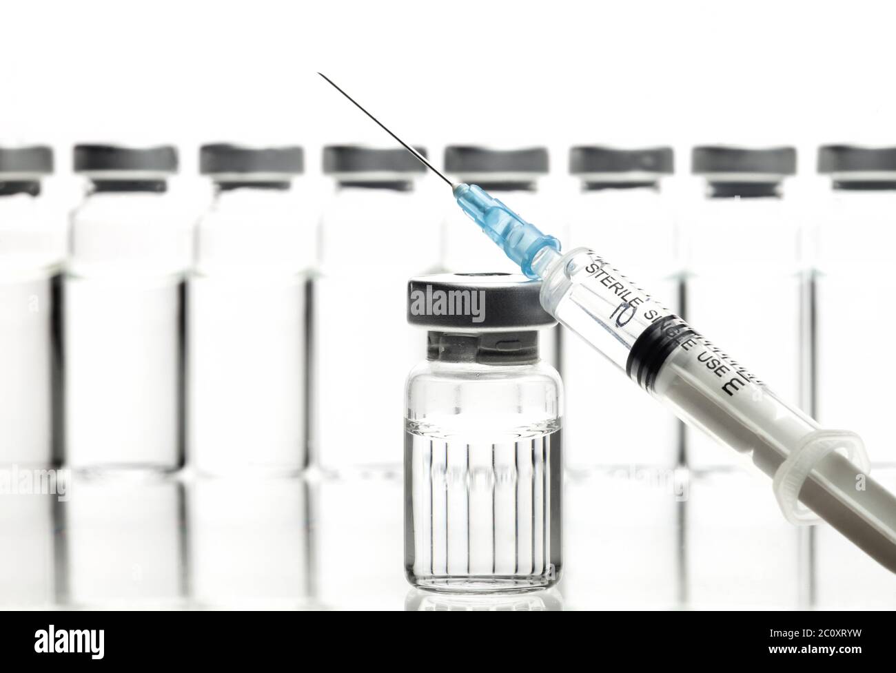 Glass Medicine Vials and Syringe on white background Stock Photo - Alamy