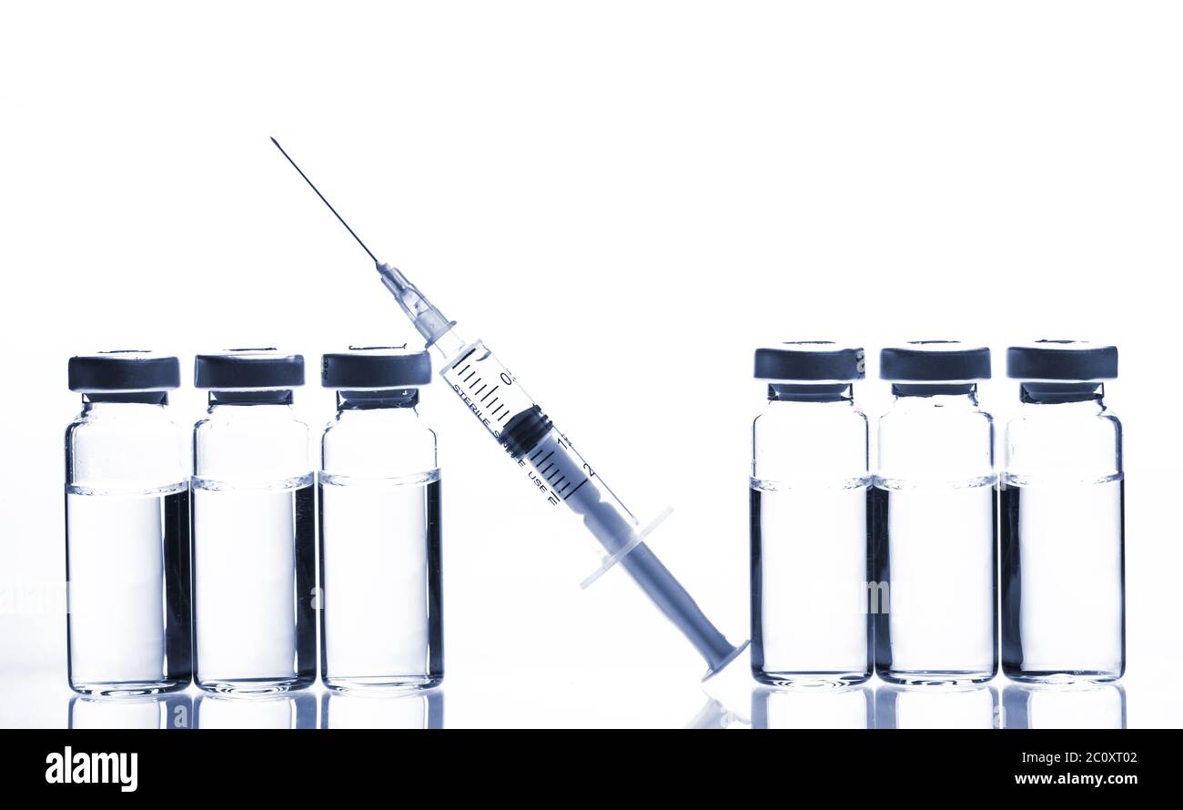 Glass Medicine Vials and Syringe on white background Stock Photo - Alamy