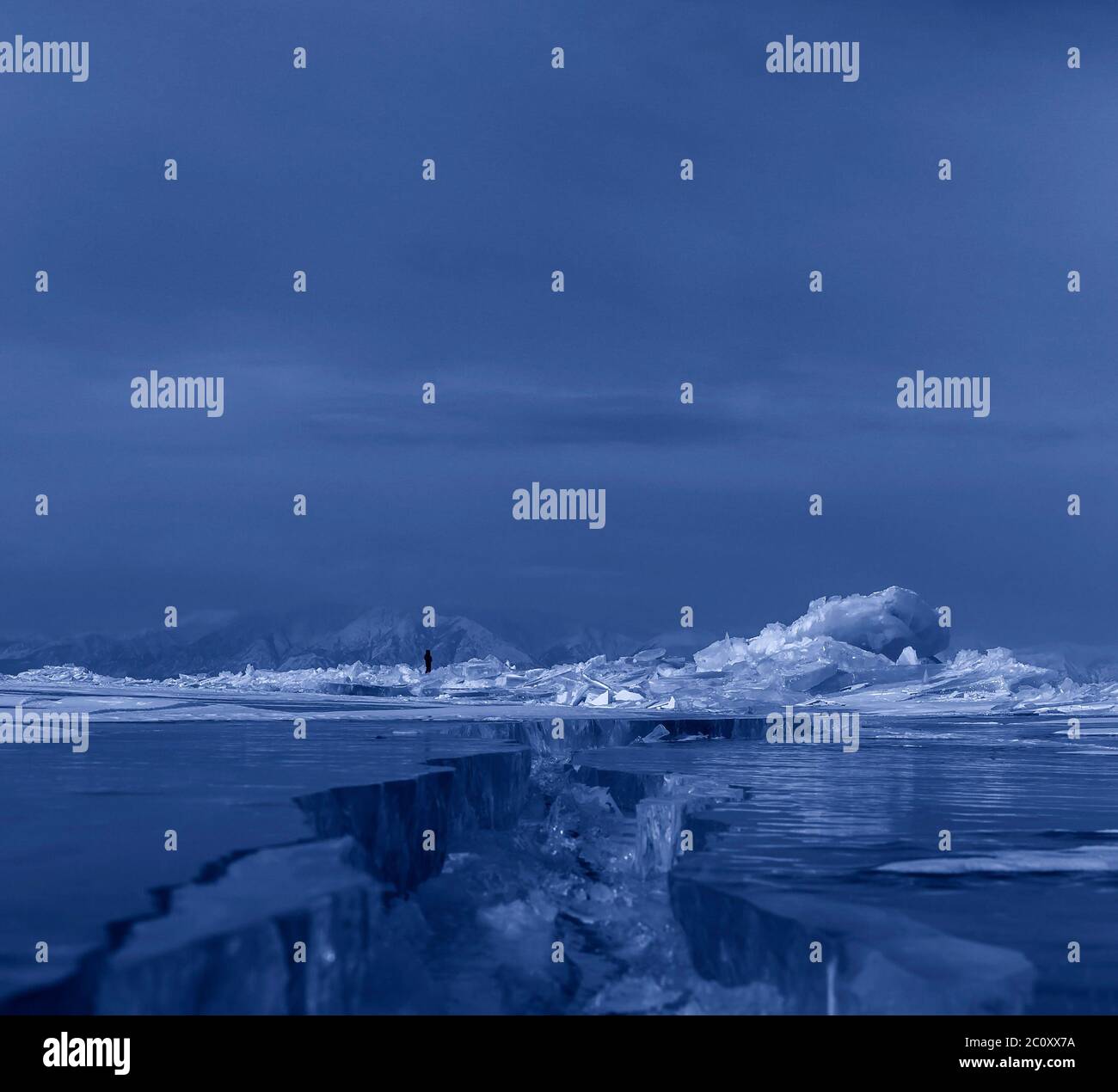 Large cracks on surface of the ice Stock Photo - Alamy
