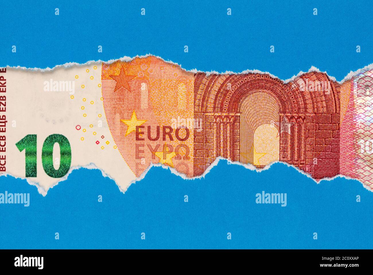 Ten Euro in torn paper frame Stock Photo - Alamy