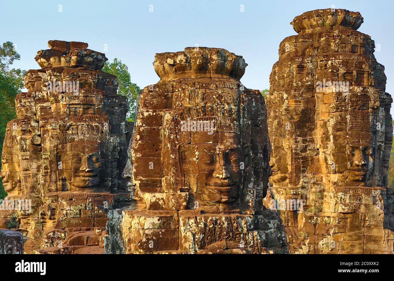 Giant stone faces at Bayon Temple in Cambodia Stock Photo - Alamy