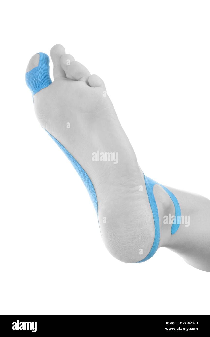 Therapeutic tape on female foot Stock Photo - Alamy