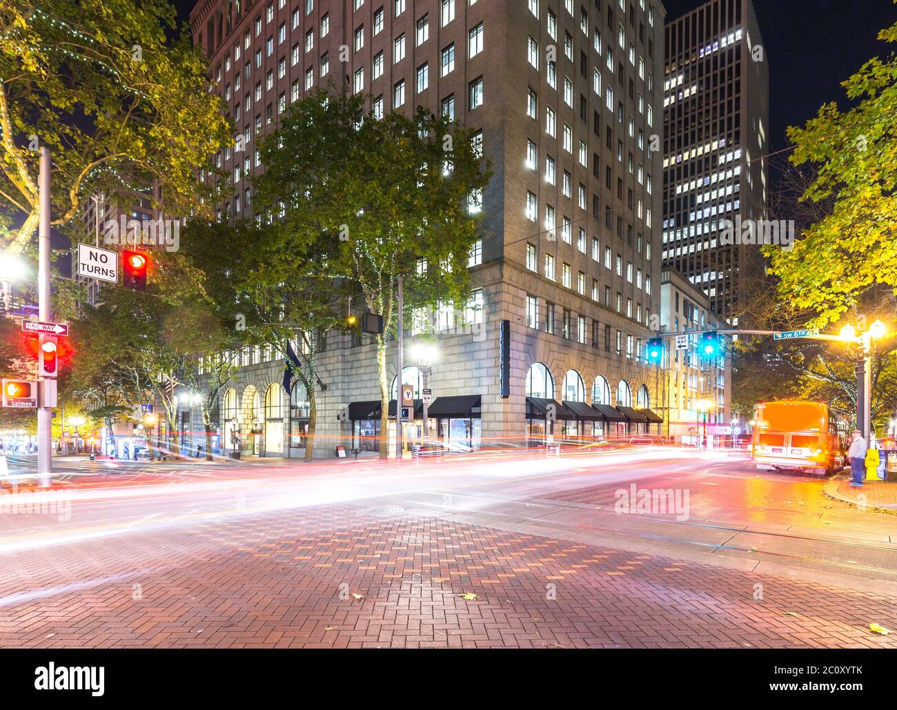 intersection of brick road and modern building Stock Photo - Alamy