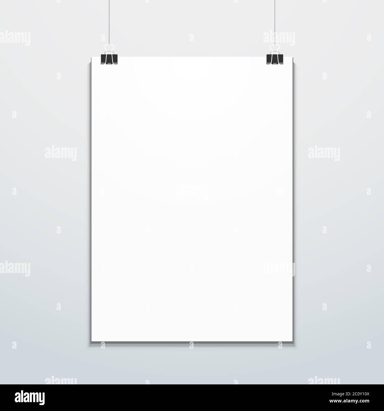 vertical poster suspended on office clips mockup Stock Photo - Alamy