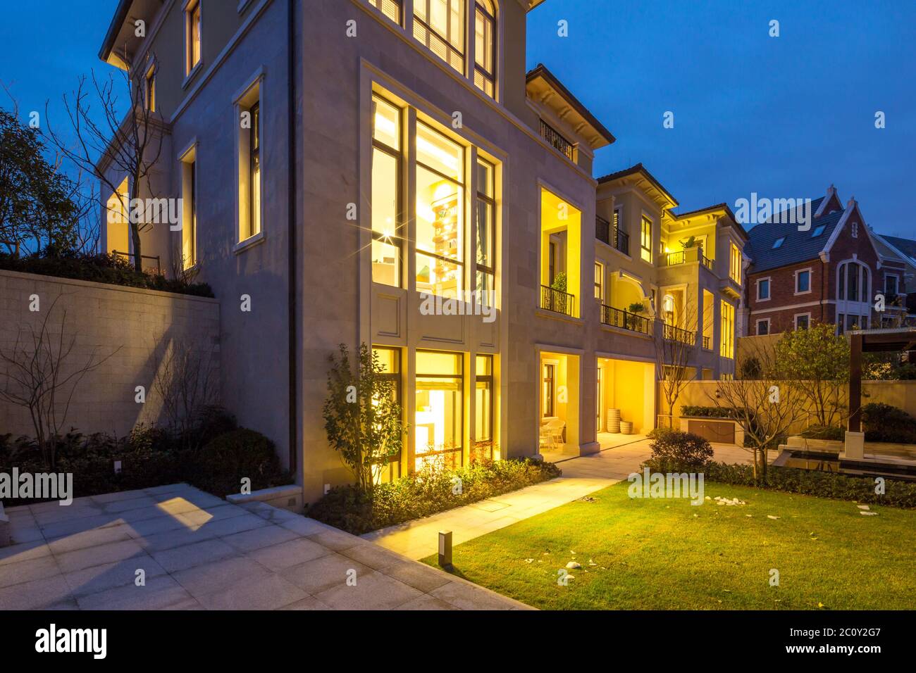 houses in modern villa at night Stock Photo - Alamy
