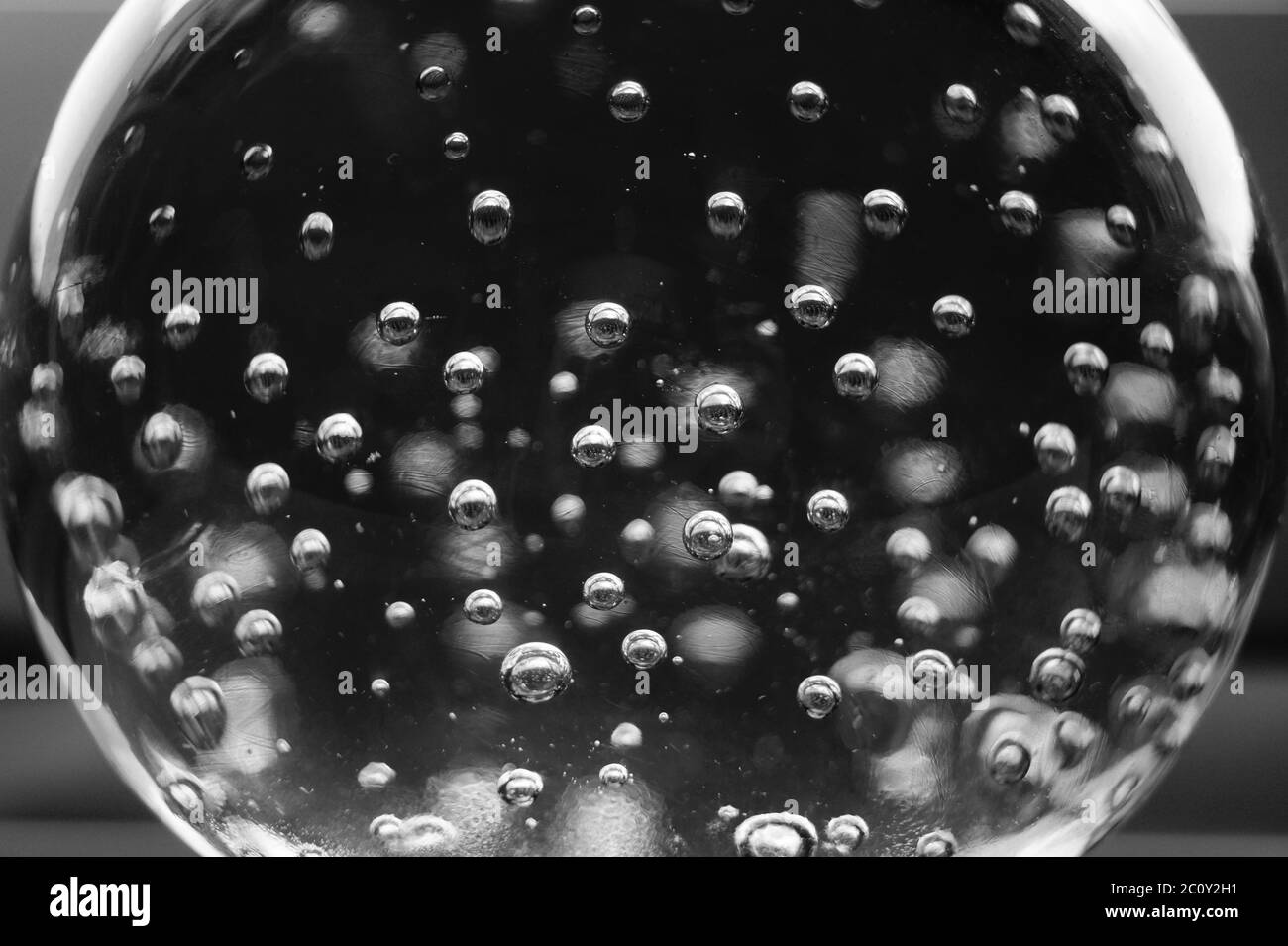A close up of glas ball, sad depressed black and white, bubble water ...