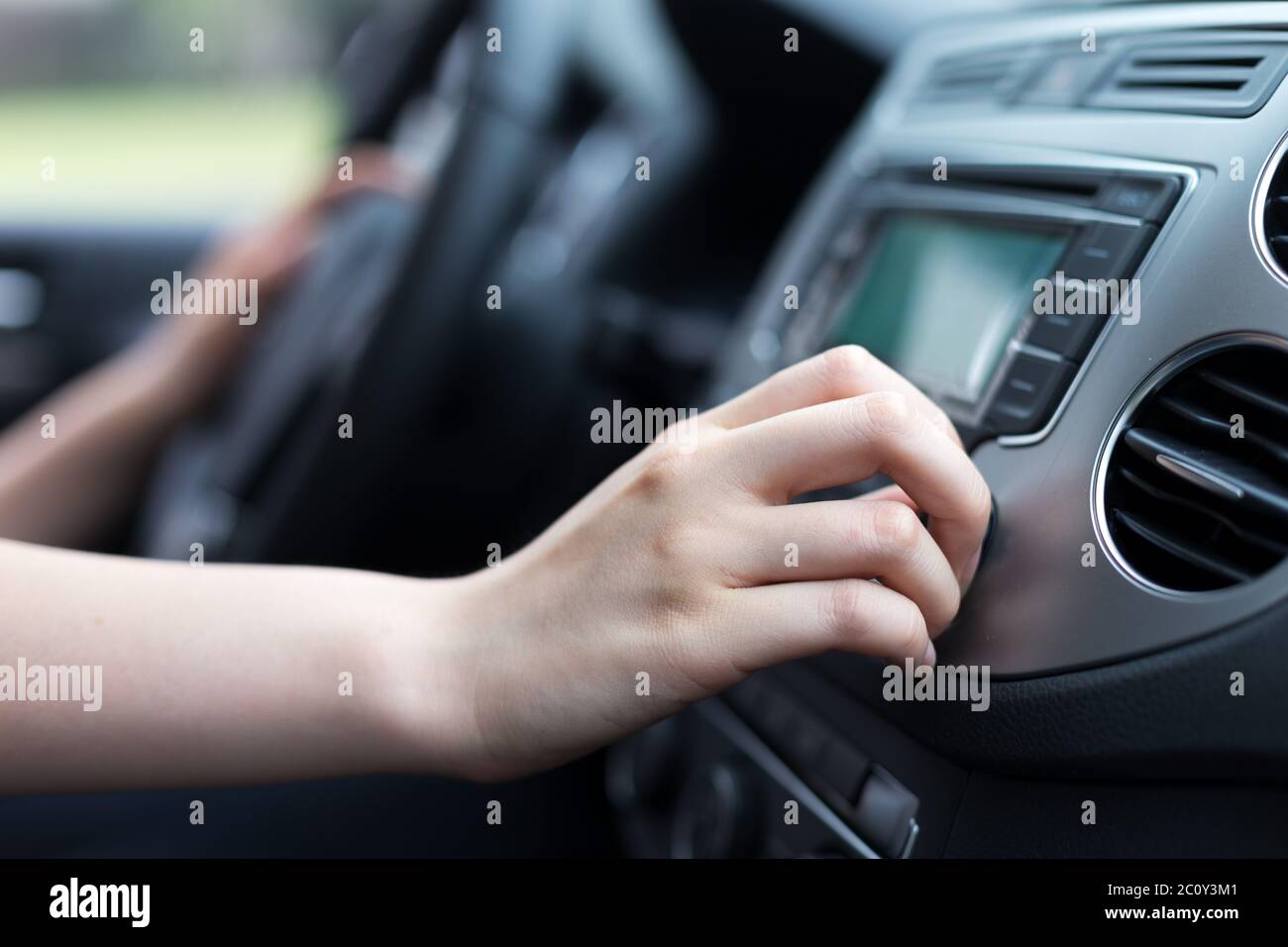 Woman Listening To Radio In Car