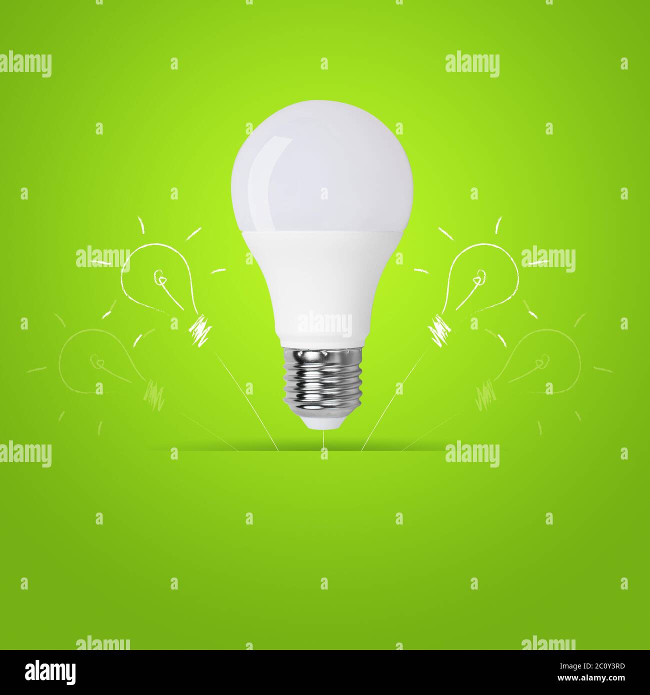 led bulb on green background Stock Photo - Alamy