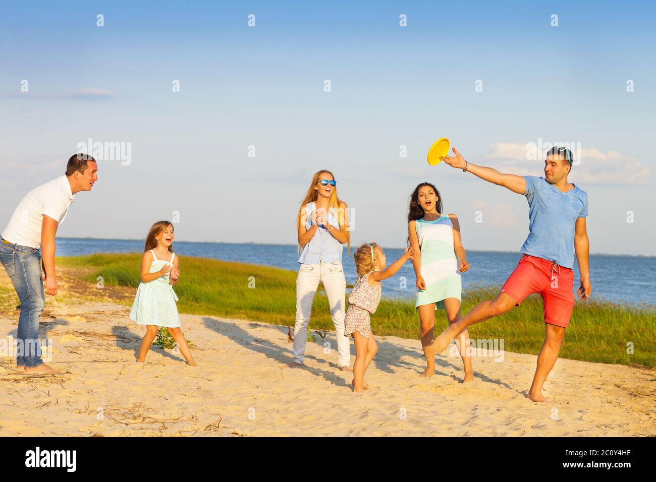 Man playing with frisbee on the beach hi-res stock photography and ...