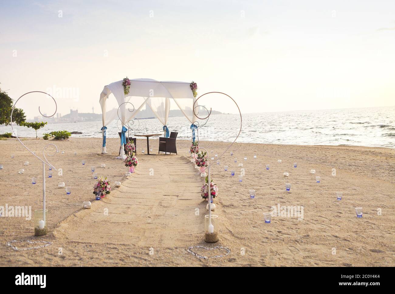 Romantic dinner setup on the beach Stock Photo - Alamy