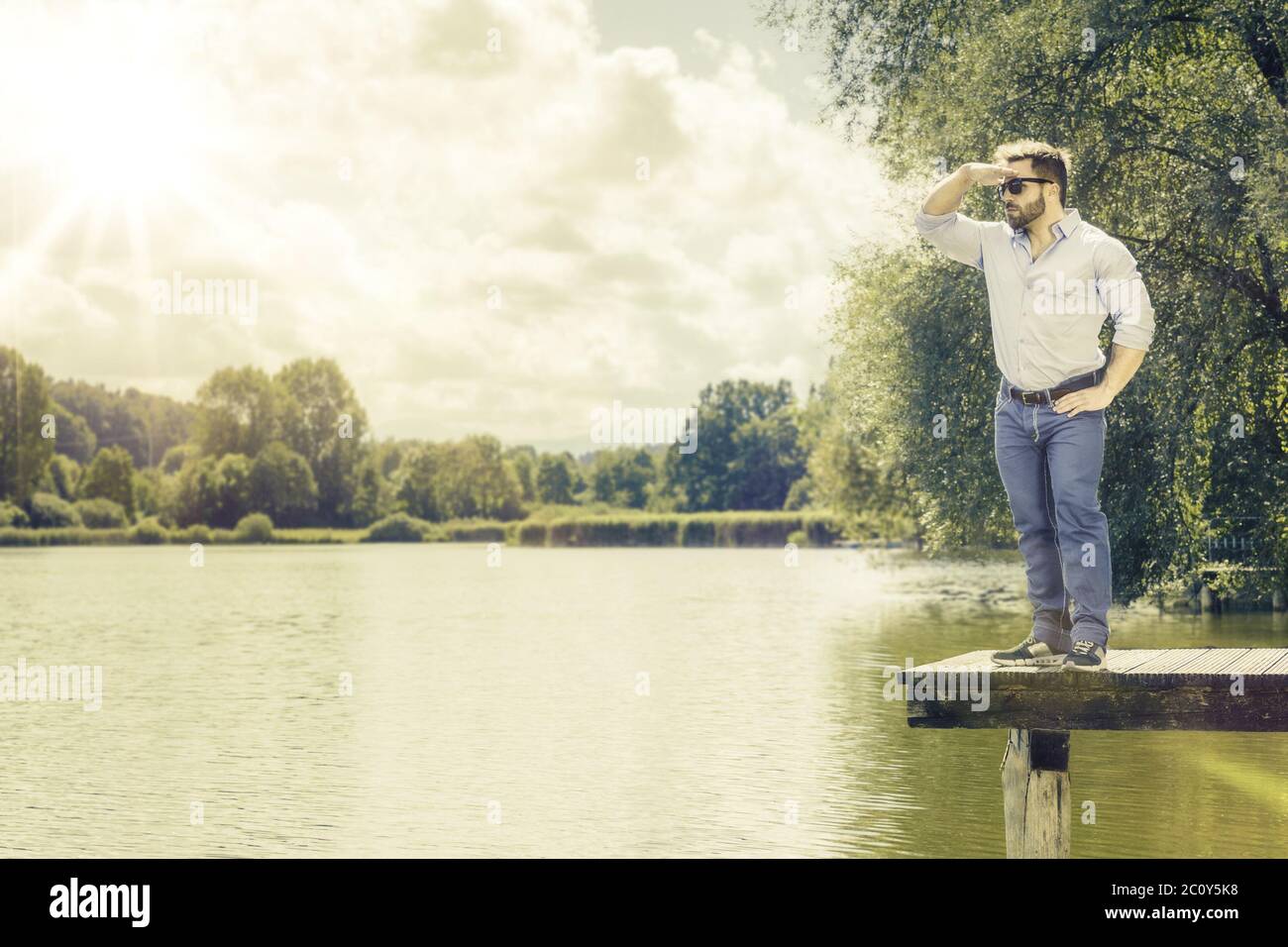 Person standing lake watching hi-res stock photography and images - Alamy