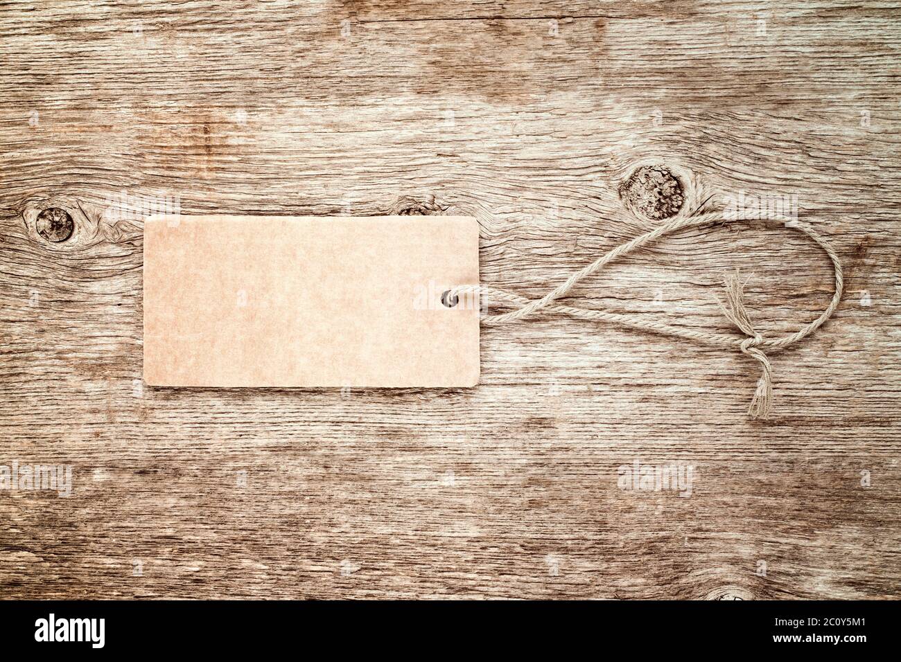 Blank tag tied with string Stock Photo - Alamy