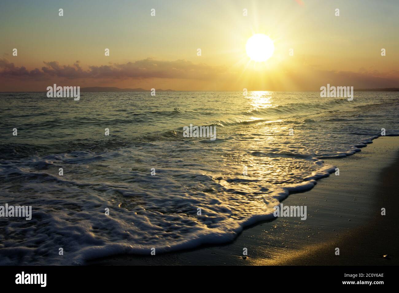 Sunset over the sea Stock Photo - Alamy