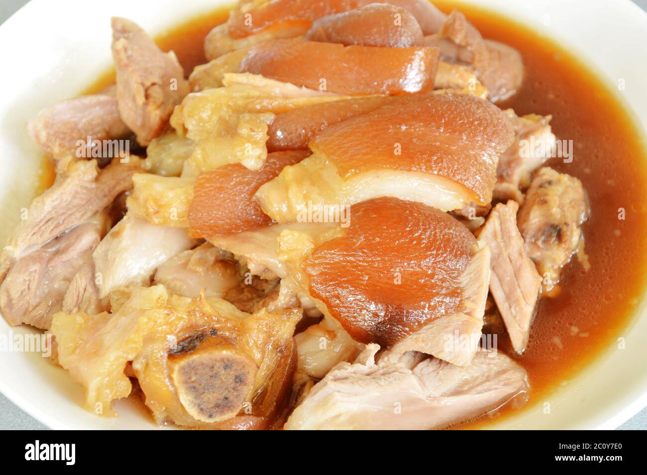 boiled pork leg with black Chinese herb soup slice on plate Stock Photo ...