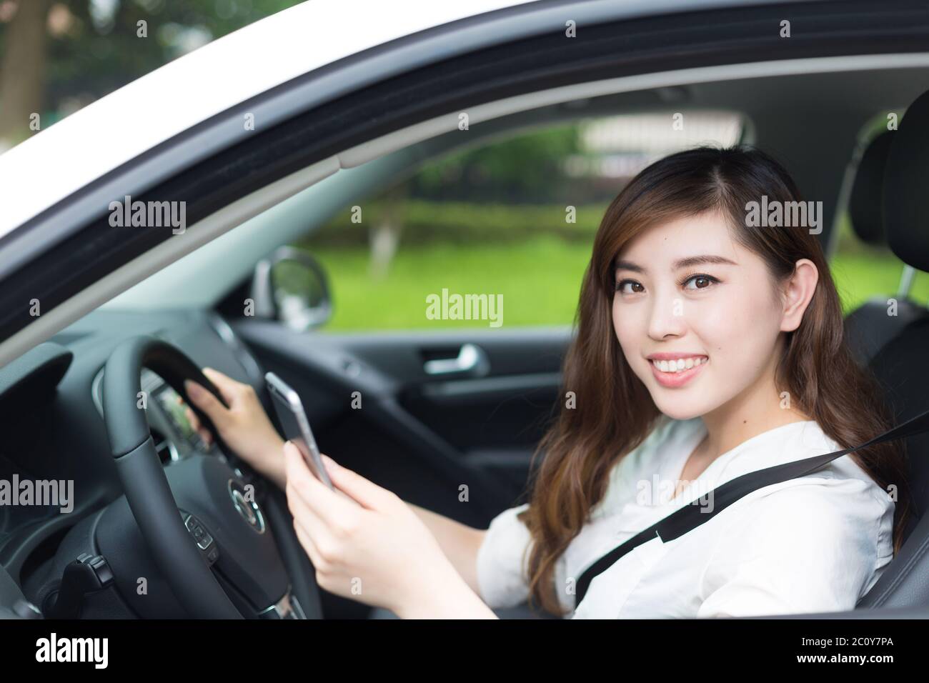 young beautiful asian girl in car Stock Photo - Alamy