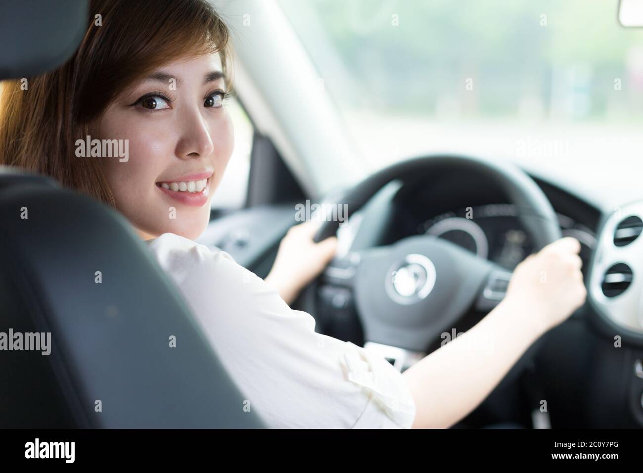 young beautiful asian girl in car Stock Photo - Alamy