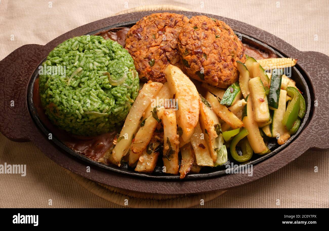 VEGETABLE SIZZLER WITH FRIES, BEAN PATTY, SPINACH RICE, ZUCCINI ...