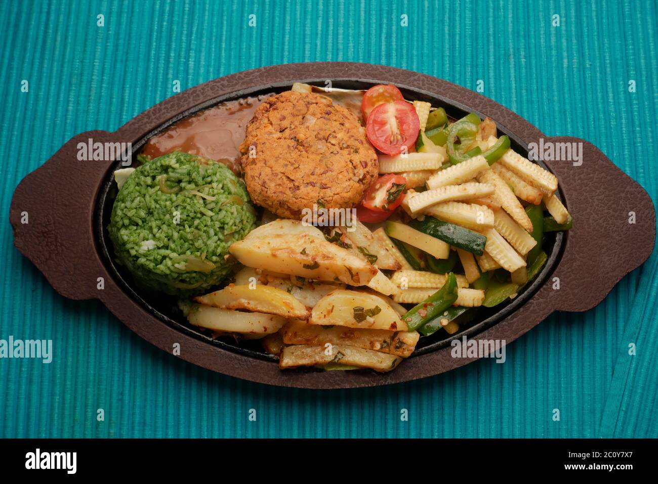 VEGETABLE SIZZLER WITH FRIES, BEAN PATTY, SPINACH RICE, ZUCCINI ...