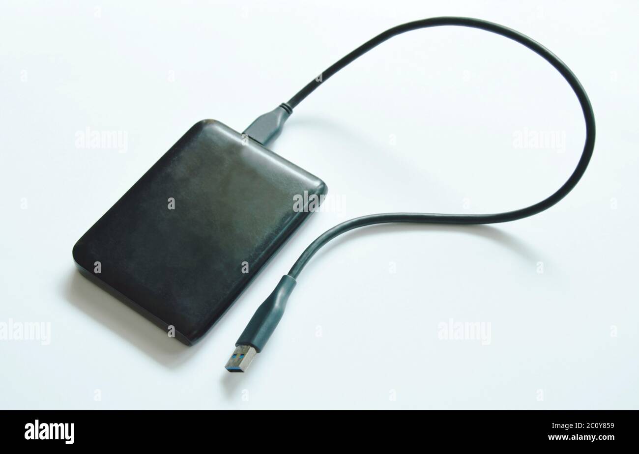 black universal serial bus external hard disk connecting to computer on ...