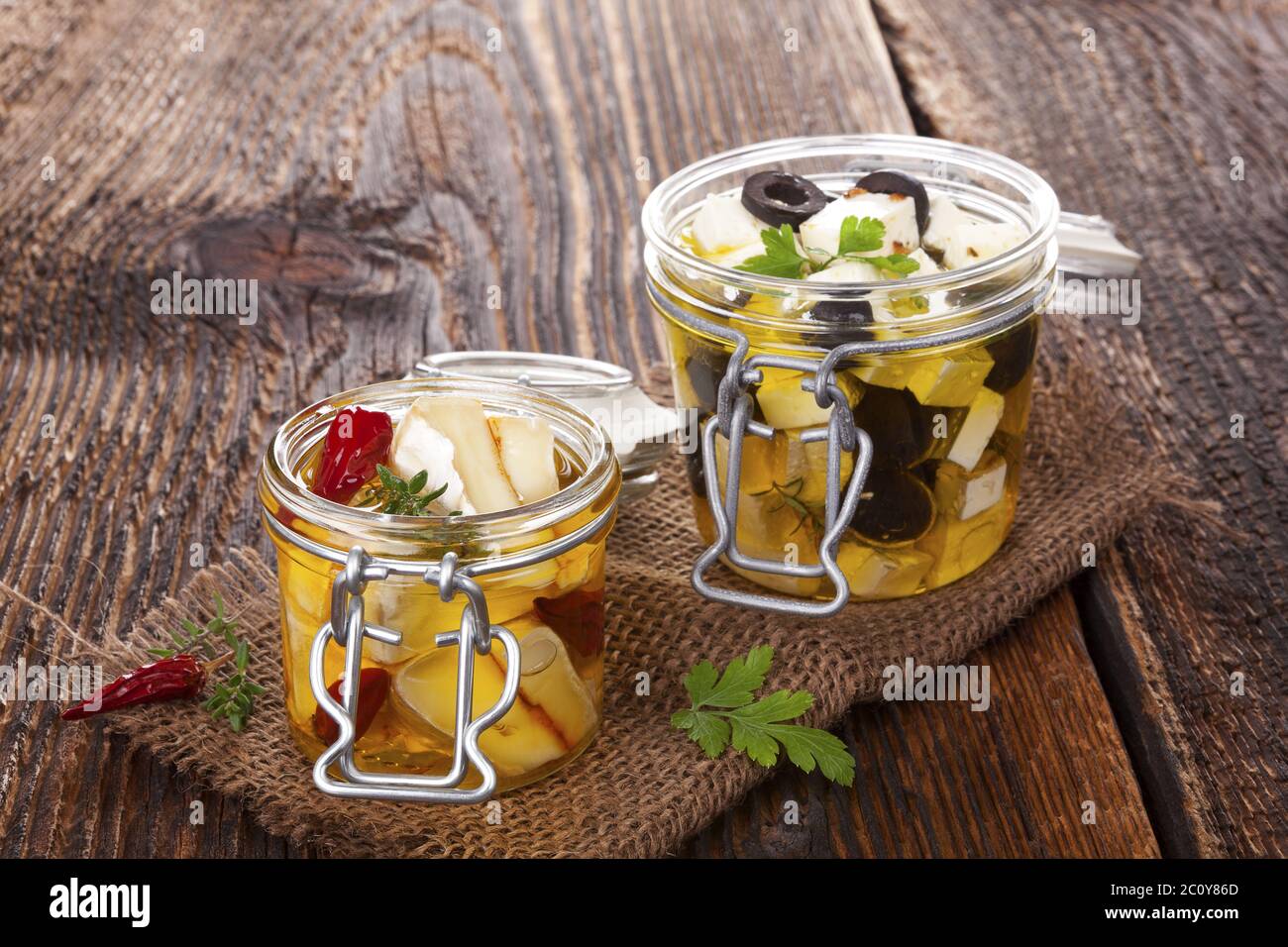 Marinated cheese in oil Stock Photo - Alamy