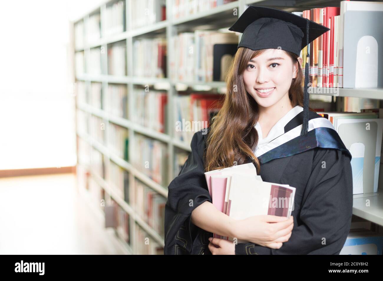 young beautiful asian girl student in library Stock Photo - Alamy