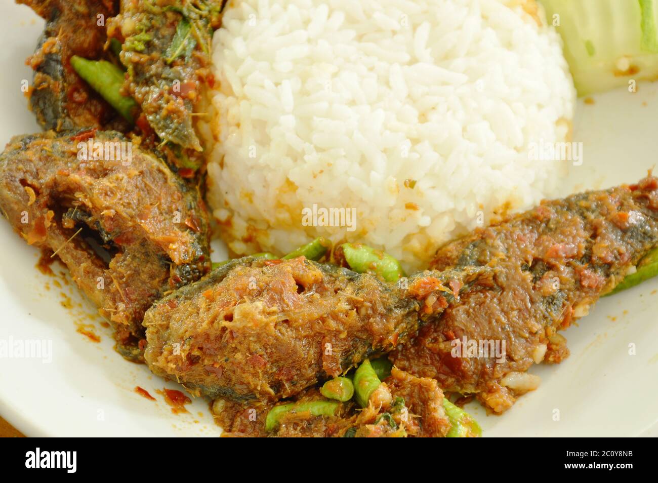 spicy stir fried crispy catfish curry with rice on plate Stock Photo ...
