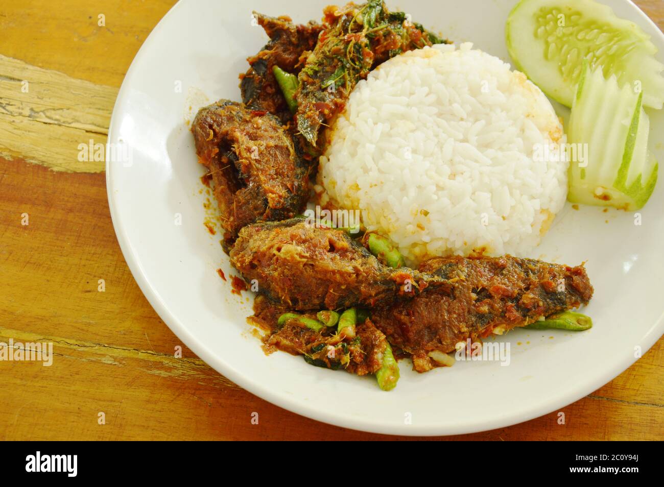 spicy stir fried crispy catfish curry with rice on plate Stock Photo ...