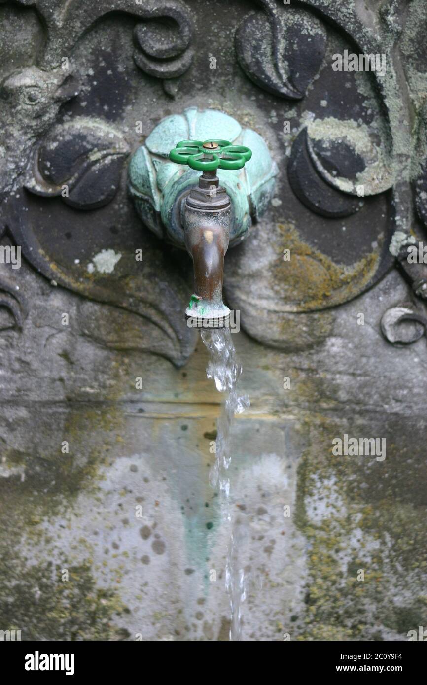 Water tap of a waterhole at the cemetery in Hameln Stock Photo - Alamy