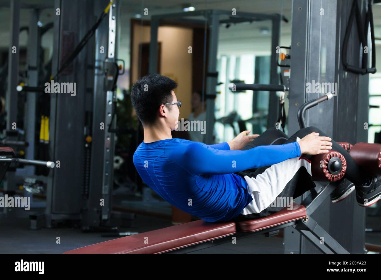 Young chinese man exercising gym hi-res stock photography and images ...
