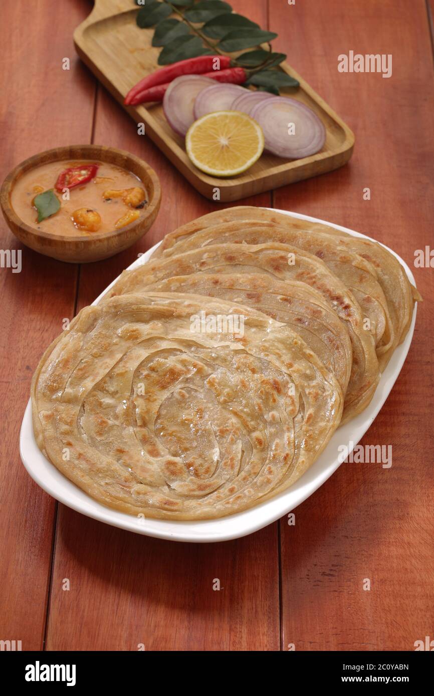 Homemade Kerala Parotta/porotta/paratha/layered flat bread using wheat popular in south India ...