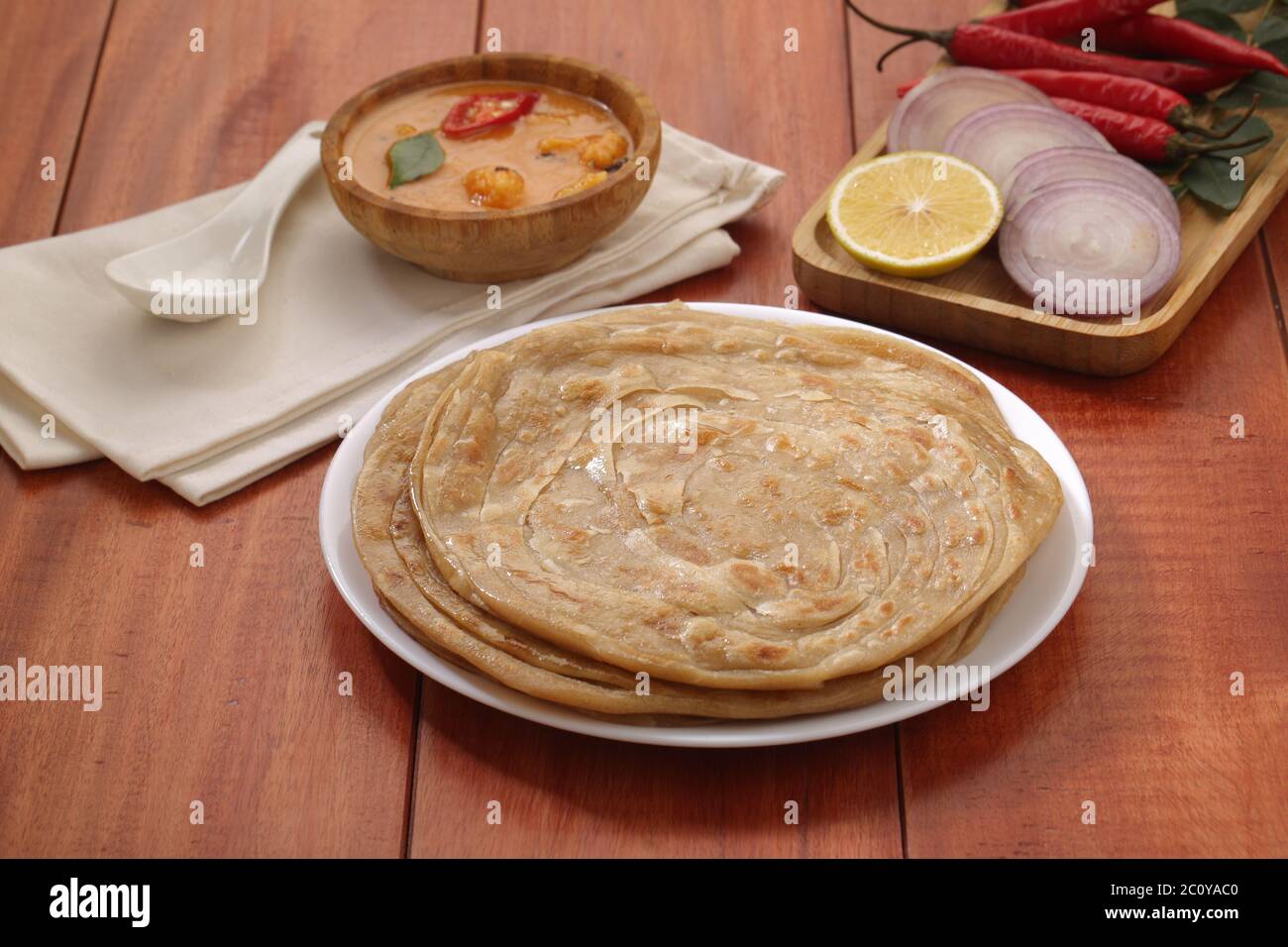 Homemade Kerala Parotta/porotta/paratha/layered flat bread using wheat popular in south India ...