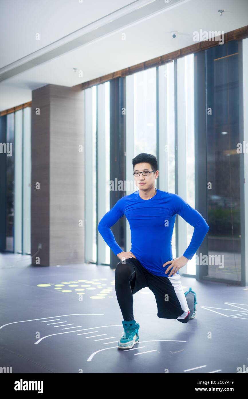 Young chinese man exercising gym hi-res stock photography and images ...