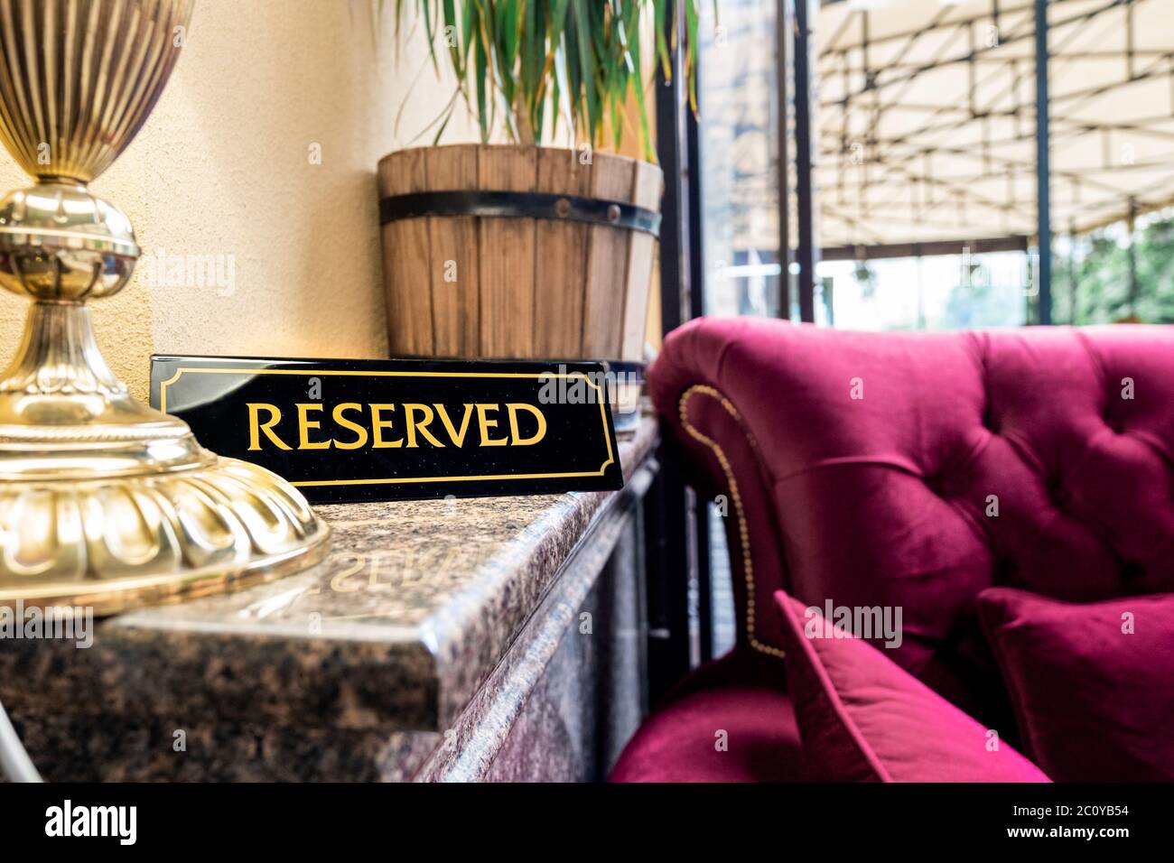 A tag of reservation placed on table. Reserved logo in a restaurant or ...
