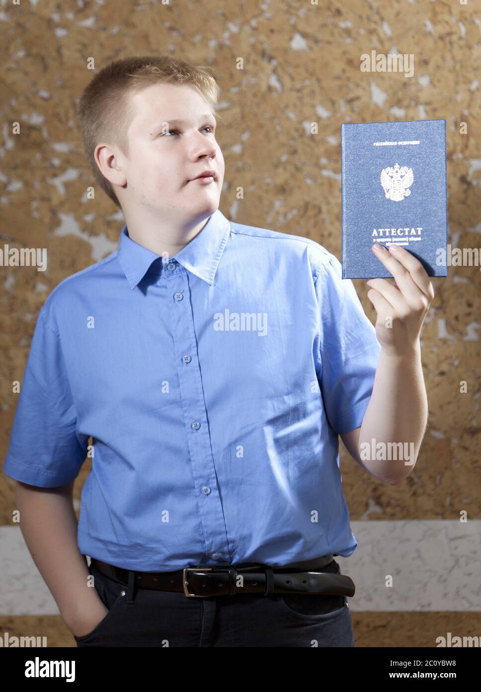 schoolboy with the certificate about completion of education at school ...