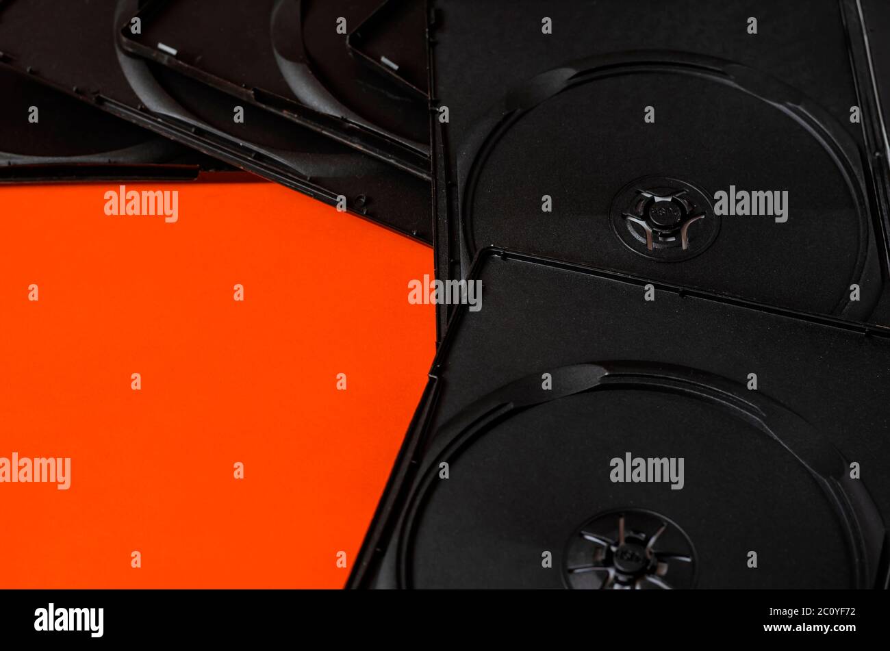 A collection of empty plastic boxes for DVD or blue ray discs. Black ...