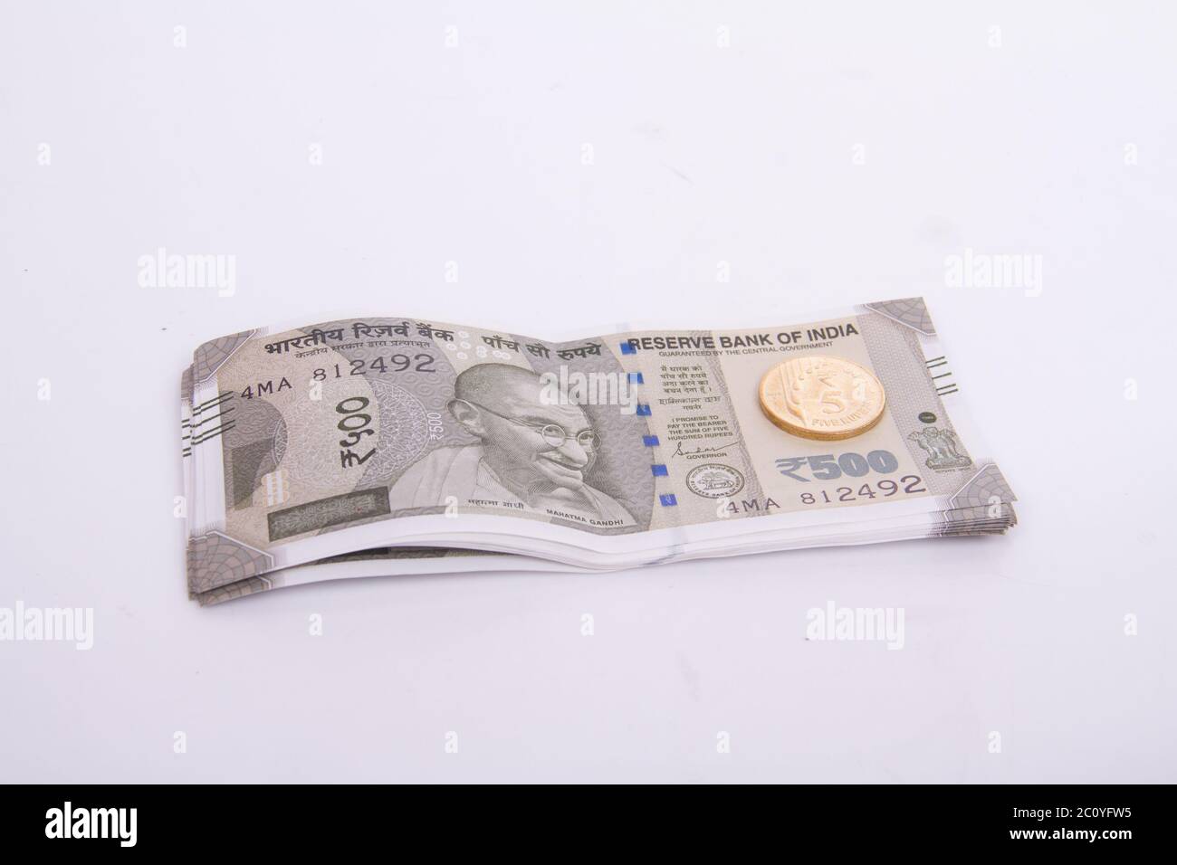 Five hundred Rupees with New Indian Five Rupee coin Stock Photo - Alamy
