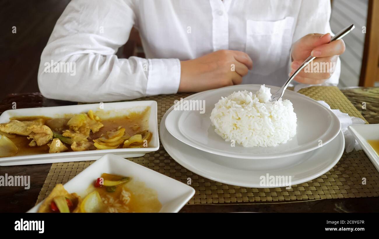 Young Woman Eating Rice Fork High Resolution Stock Photography and ...