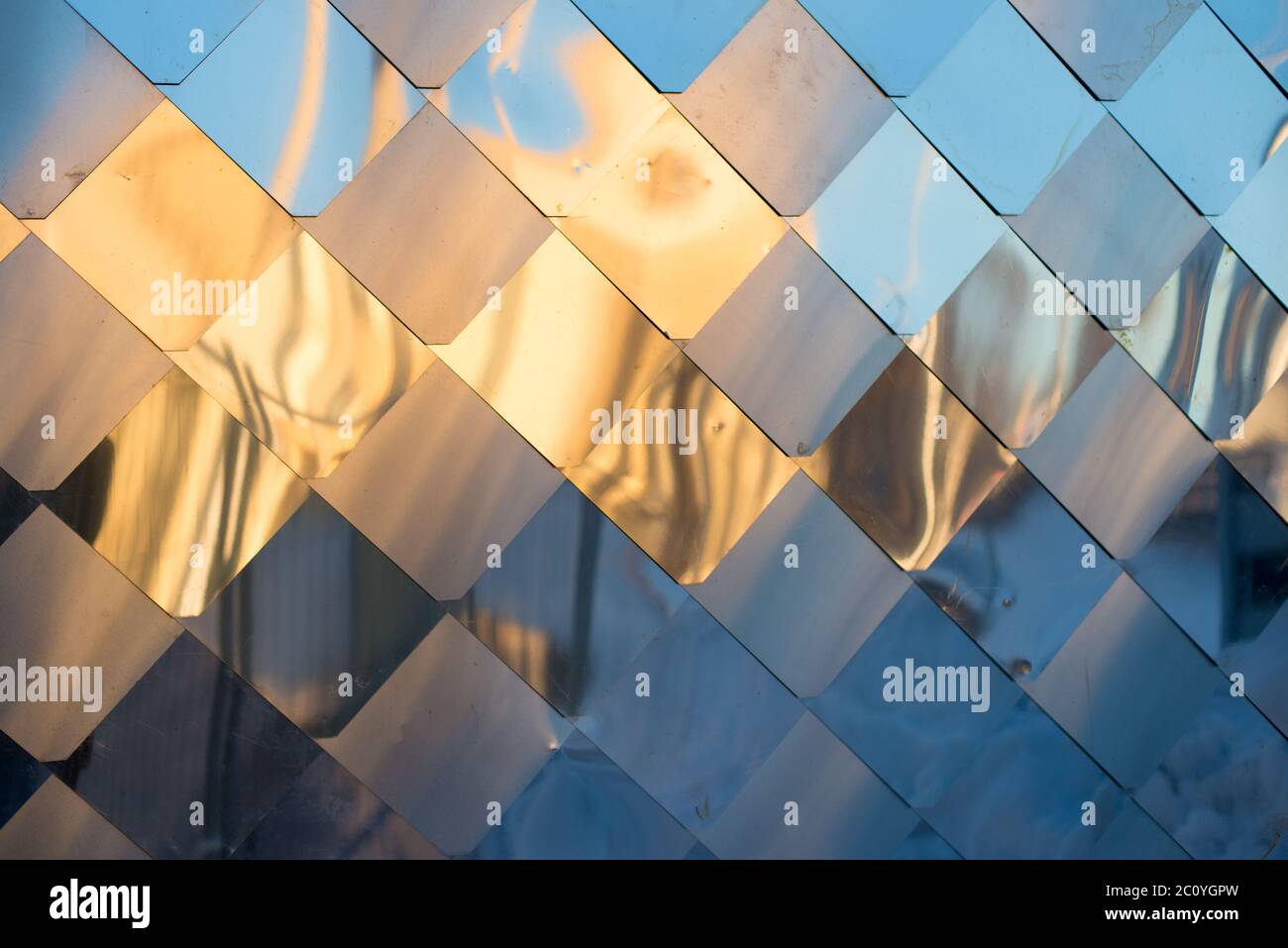 old, dirty aluminum metal wall facade panel with rhombus, similar to ...